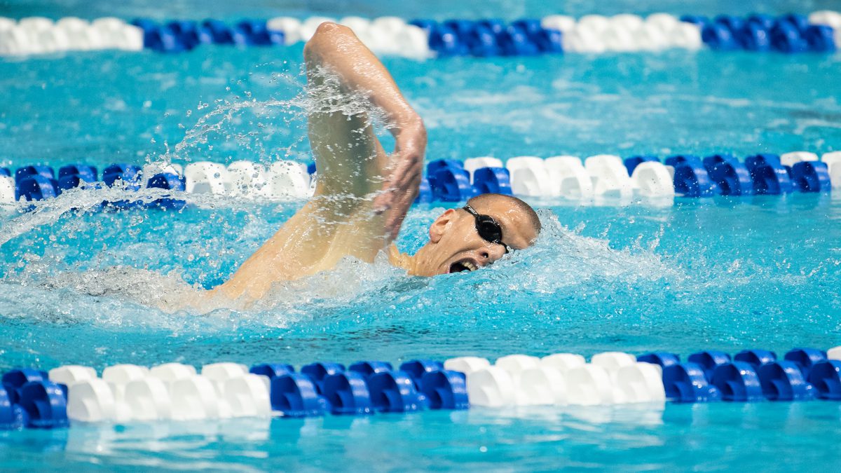 Division II Championships: Collyn Gagne Sets 400 IM Mark; Queens Leads