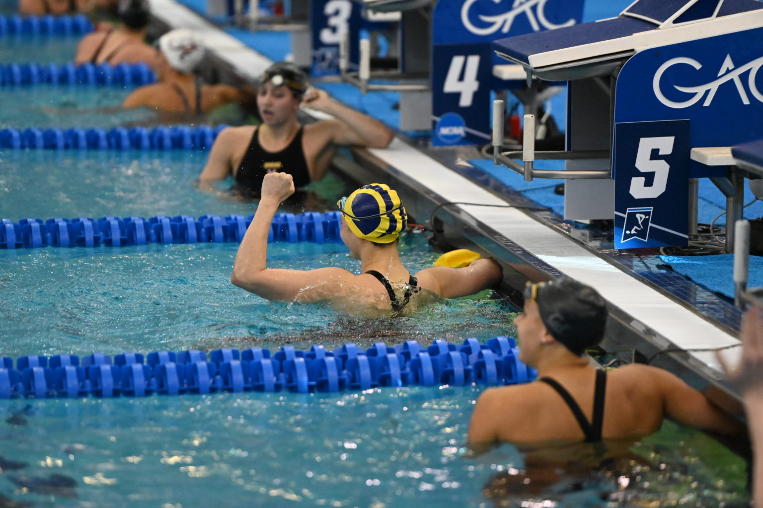 Maggie MacNeil Wins Record-Breaking Round 2 Race With Kate Douglass
