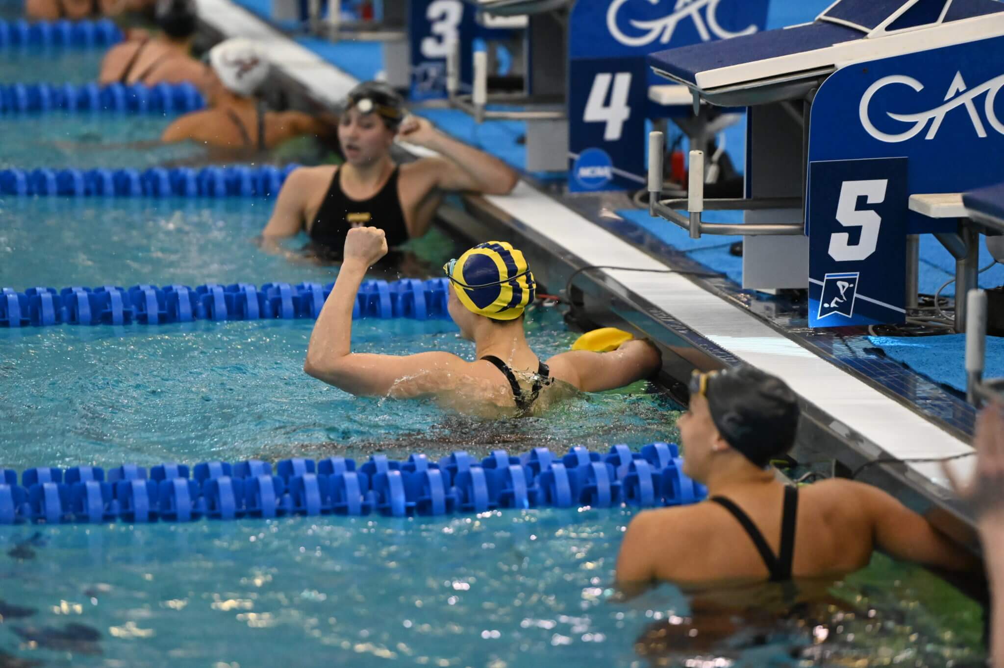 Maggie MacNeil Wins Record-Breaking Round 2 Race With Kate Douglass