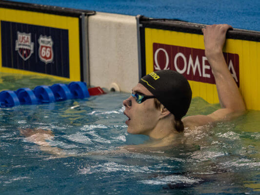 Will Modglin Sets 100 Back Meet Record; K. Wilson, M. Wanezek Win